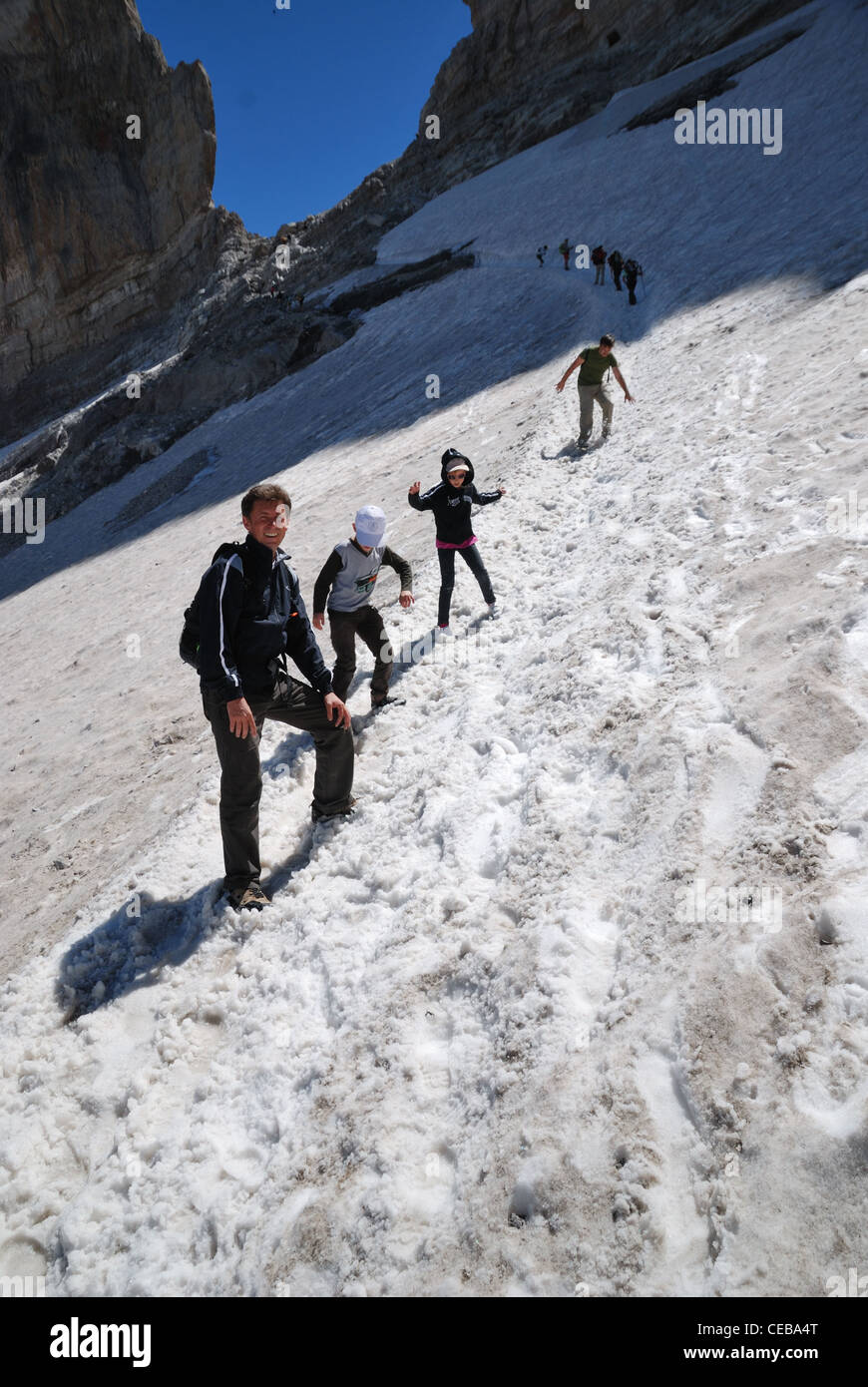 Hiker climbing steep slope hi-res stock photography and images - Alamy