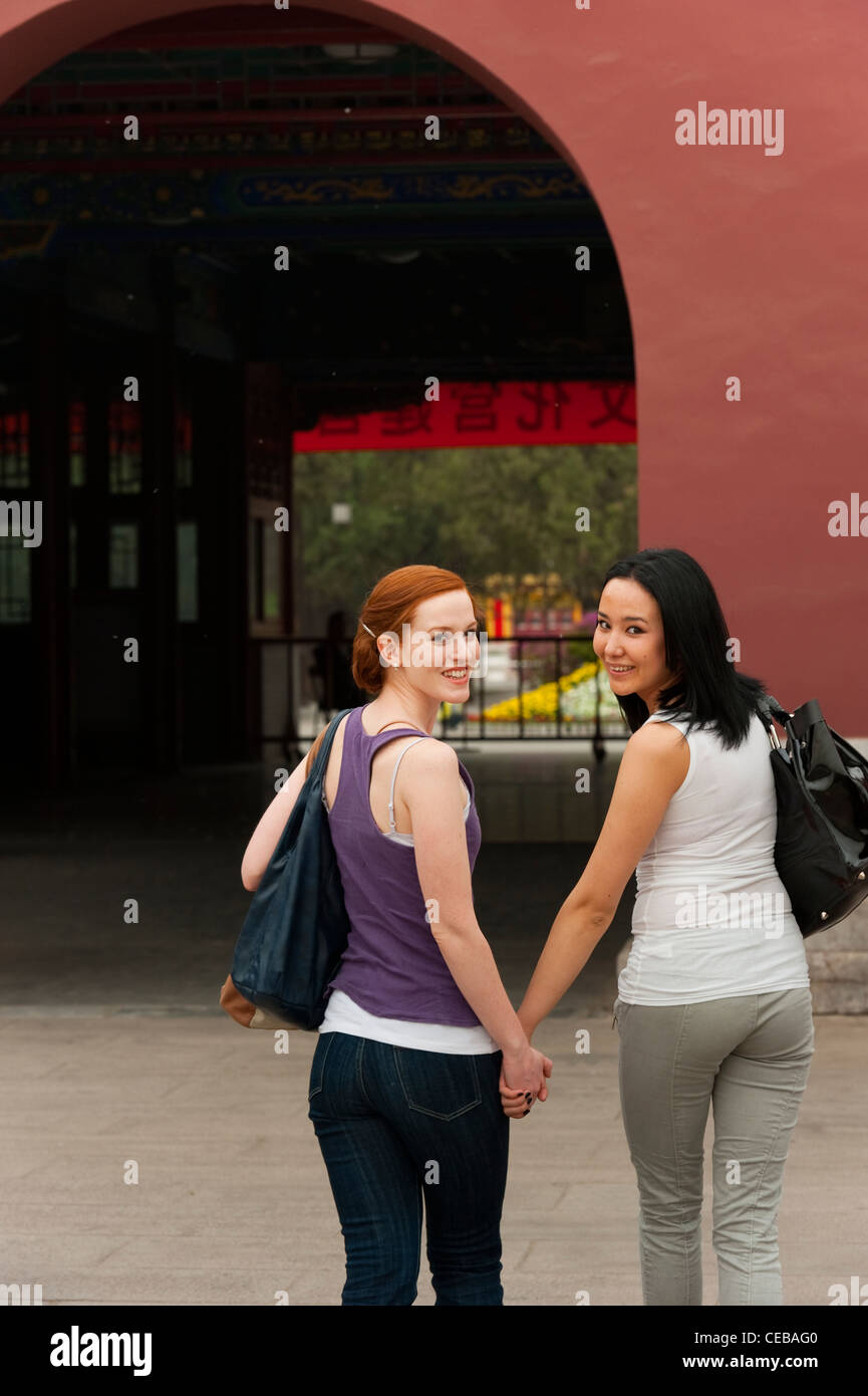 Tourists visiting The Forbidden City, looking backwards, Beijing, China ...
