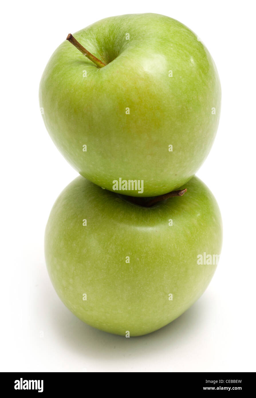 Two green apples on each other Stock Photo - Alamy