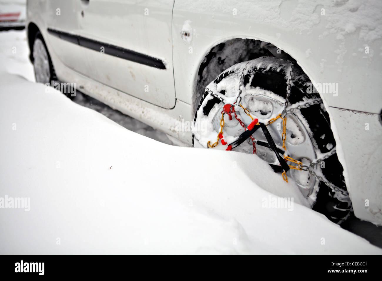 Horizontal picture of a snow-chain installed on a car's wheel Stock ...