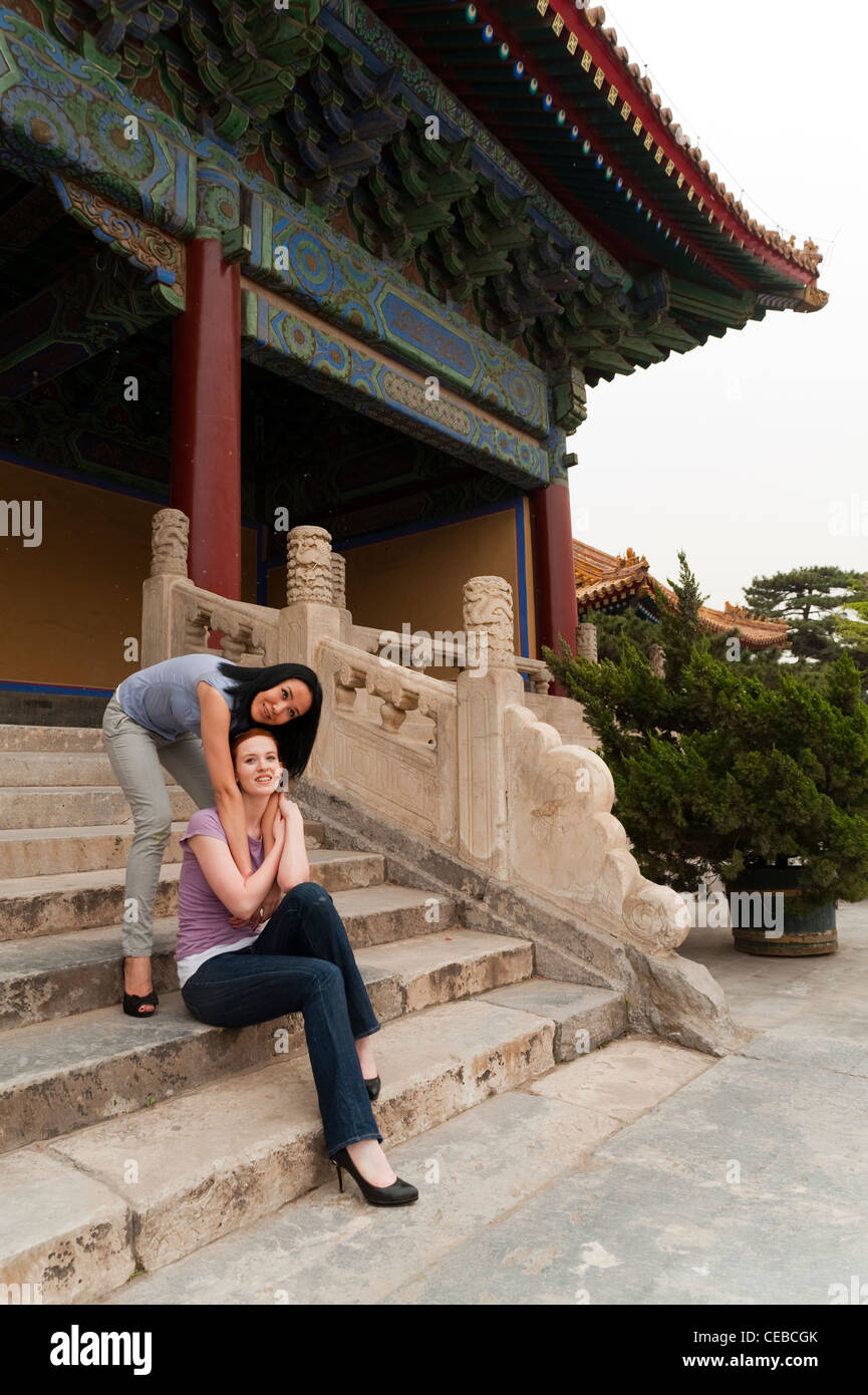 Tourist hugging her friend in The Forbidden City, Beijing, China, Asia ...