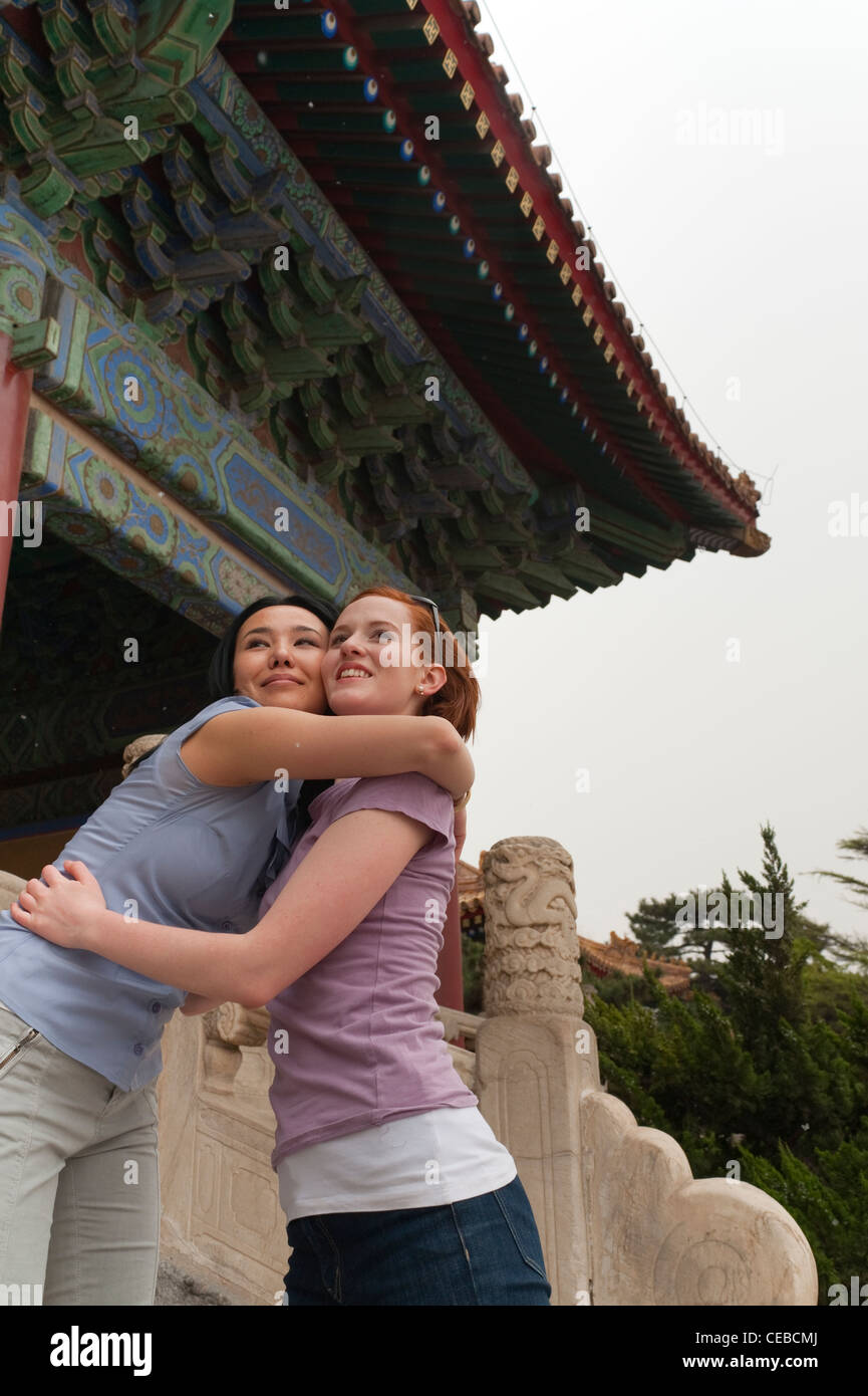 Tourists hugging each other in The Forbidden City, Beijing, China, Asia ...