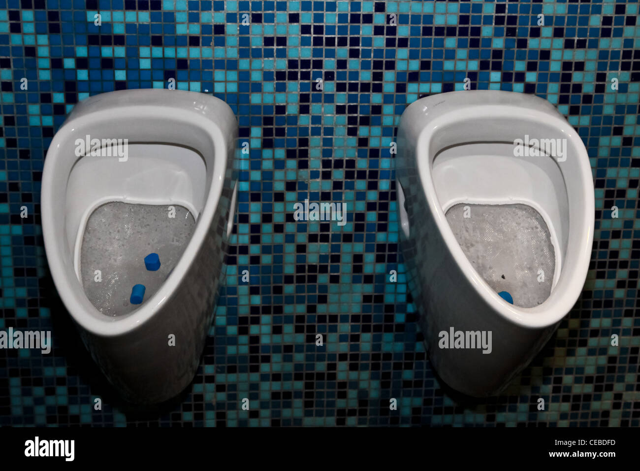 Two pissoirs on a mosaic wall in a public space in Vienna Stock Photo ...