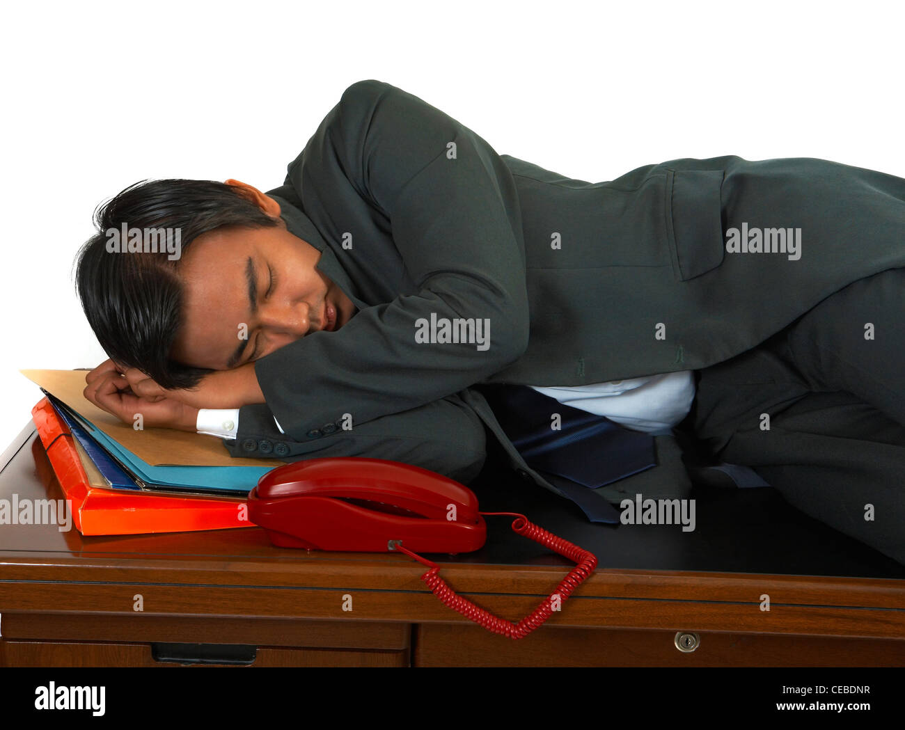 Tired And Exhausted Businessman Lying On His Desk Stock Photo - Alamy