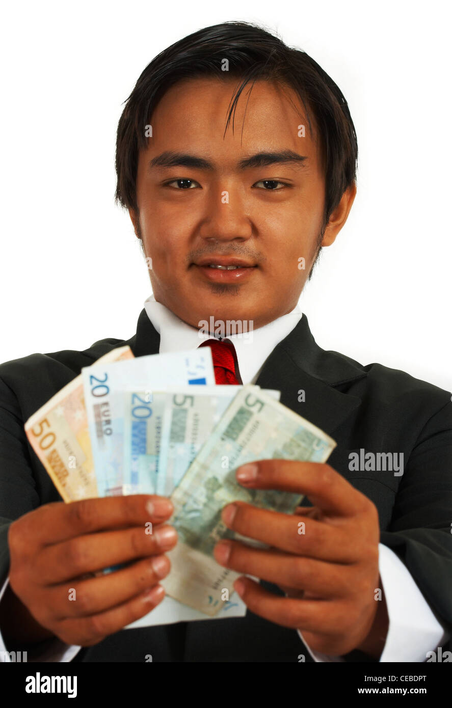 Smiling Businessman Holding Euros For A Payment Stock Photo - Alamy