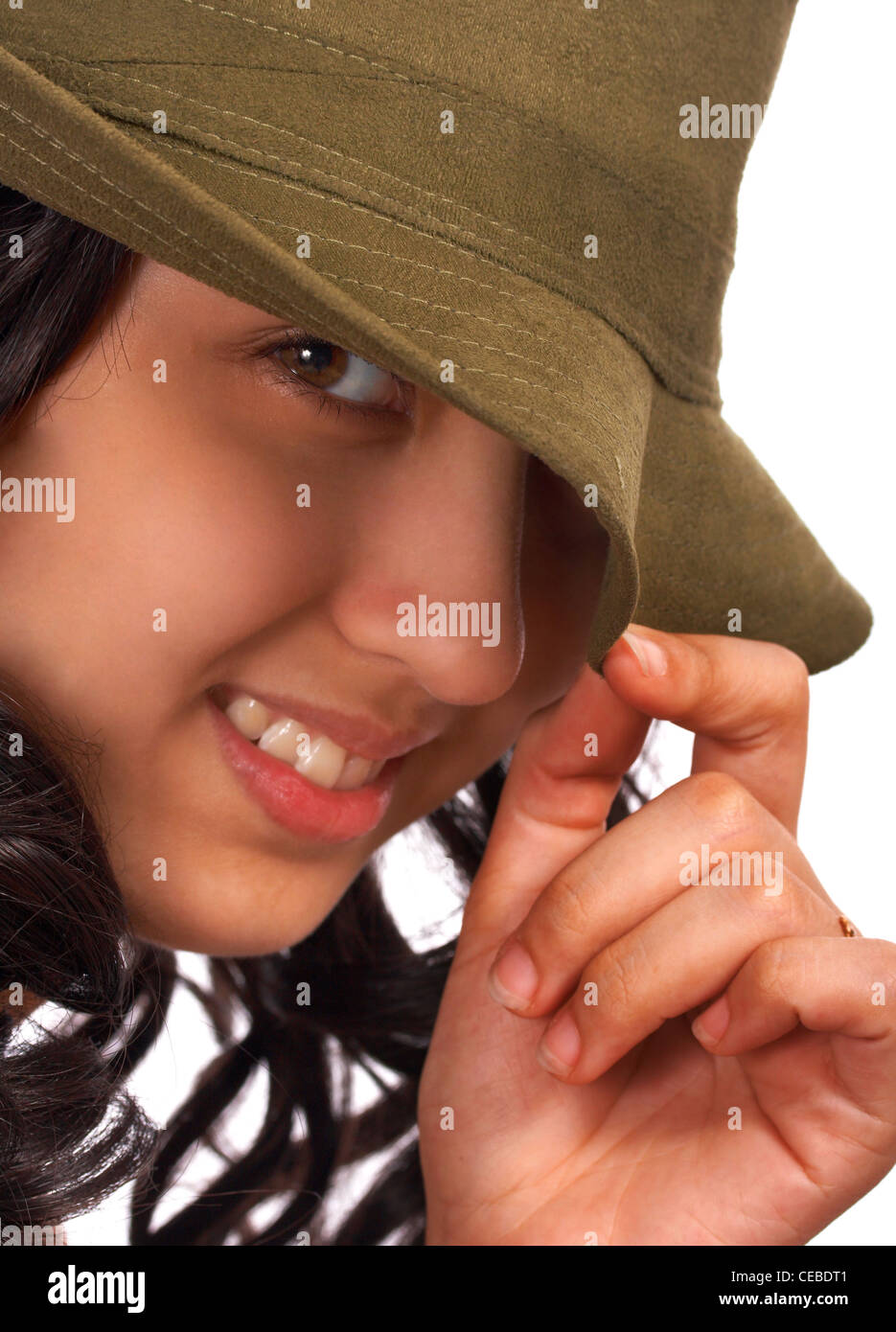 Girl In A Hat Smiling And Looking Cheeky Stock Photo - Alamy
