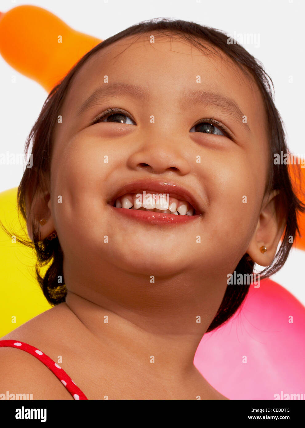 Cute Happy Kid Smiling At Her Parent Stock Photo - Alamy