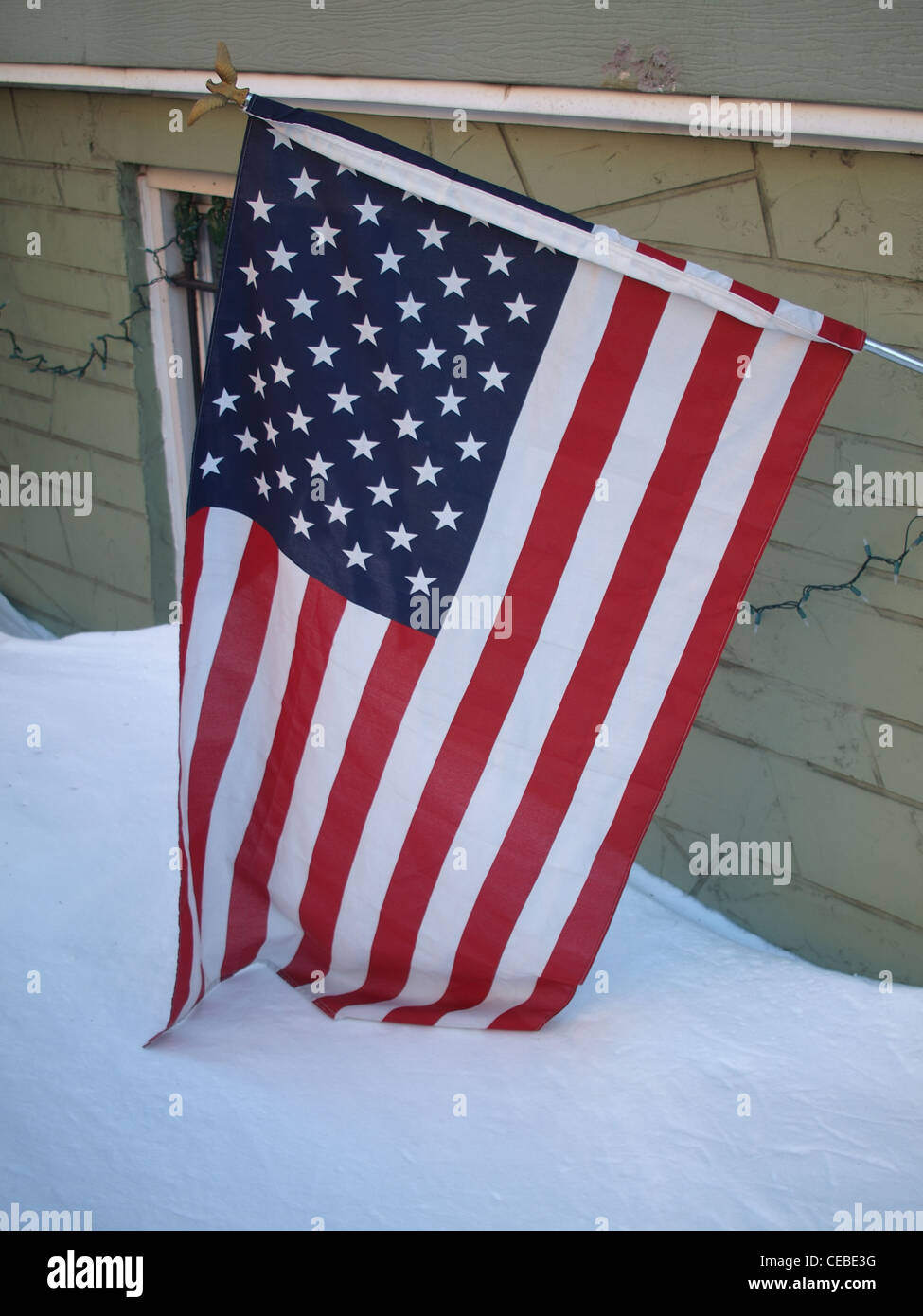 American flag in winter with snow hi-res stock photography and images ...