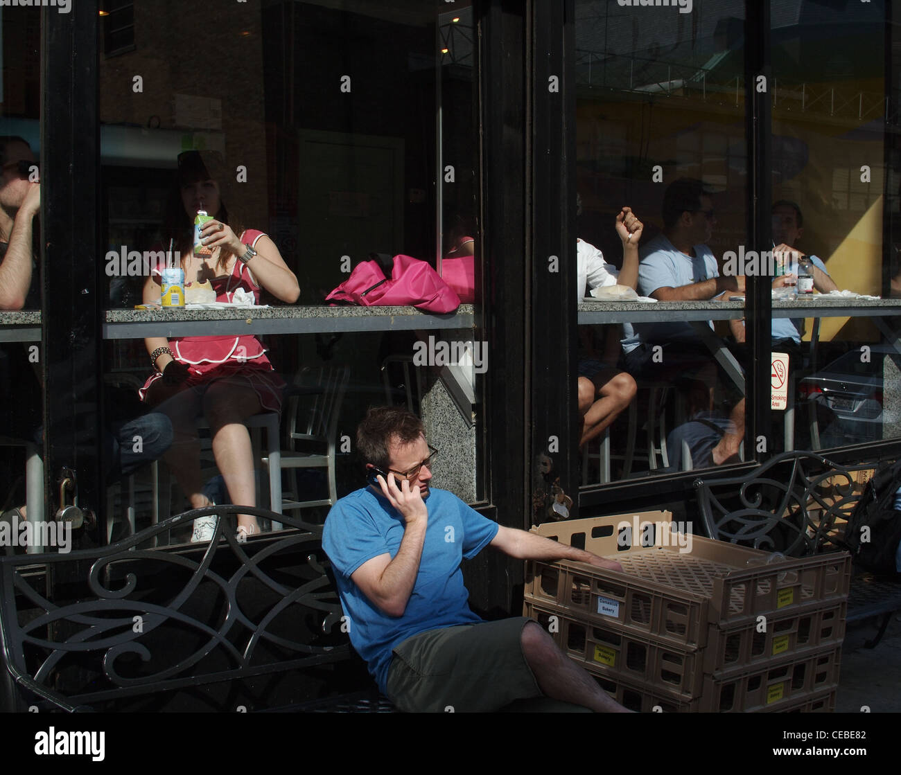 Man on phone in front of Oasis Middle Eastern restaurant, Brooklyn, New ...