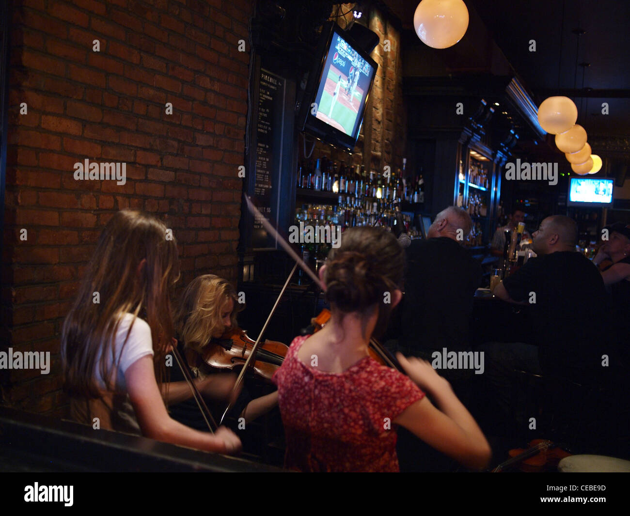 Musicians playing Irish fiddle tunes at Spike Hill Bar, Brooklyn, New ...