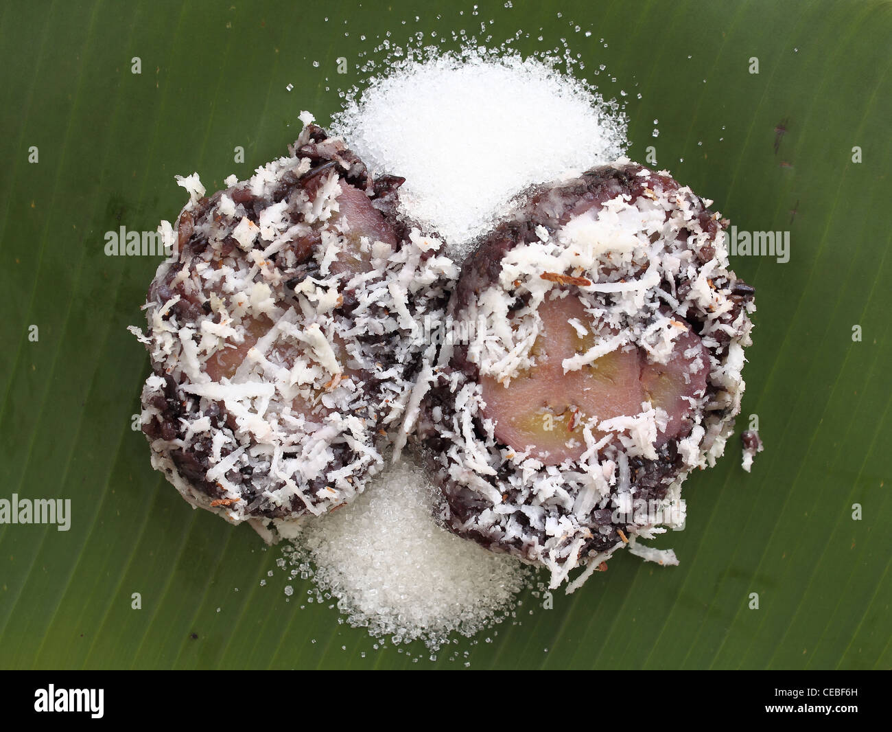 Thai style dessert, steam black glutinous rice wrap up cultivated ...