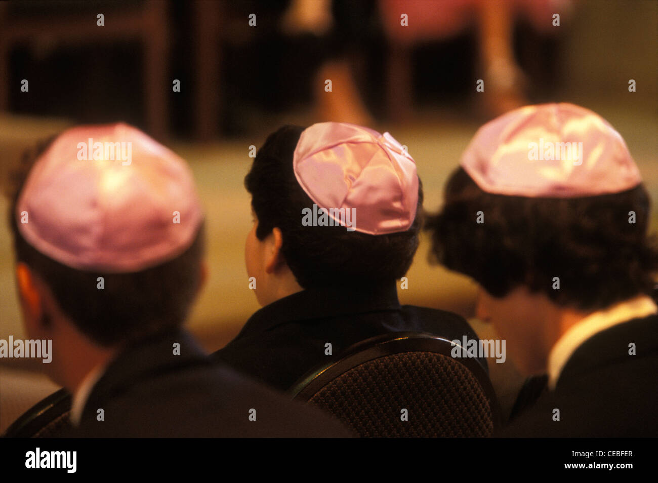 Boys dressed in kippah at a Jewish girl's bat mitzvah, her coming-of ...
