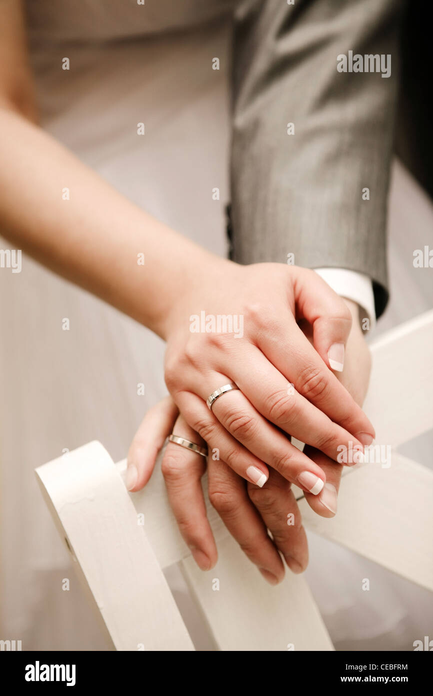 Just married couple showing up wedding rings Stock Photo - Alamy
