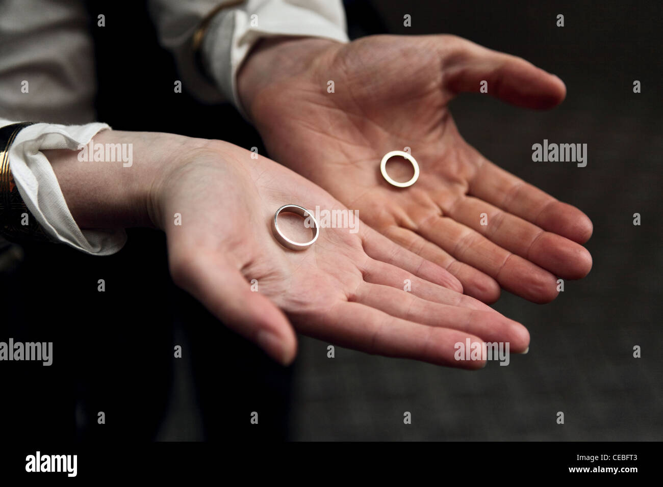 Just married couple showing up wedding rings Stock Photo - Alamy