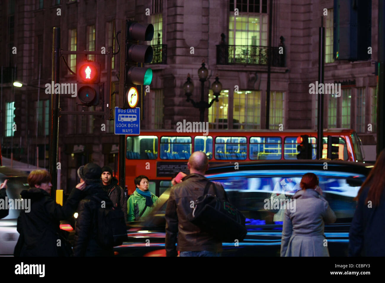 people waiting to cross a road at a pedestrian crossing in London Stock ...