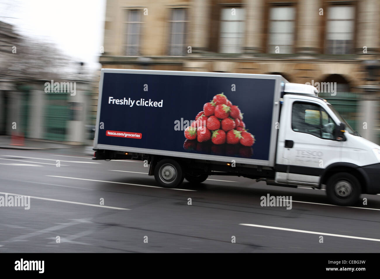A Tesco van traveling along a road in London Stock Photo - Alamy