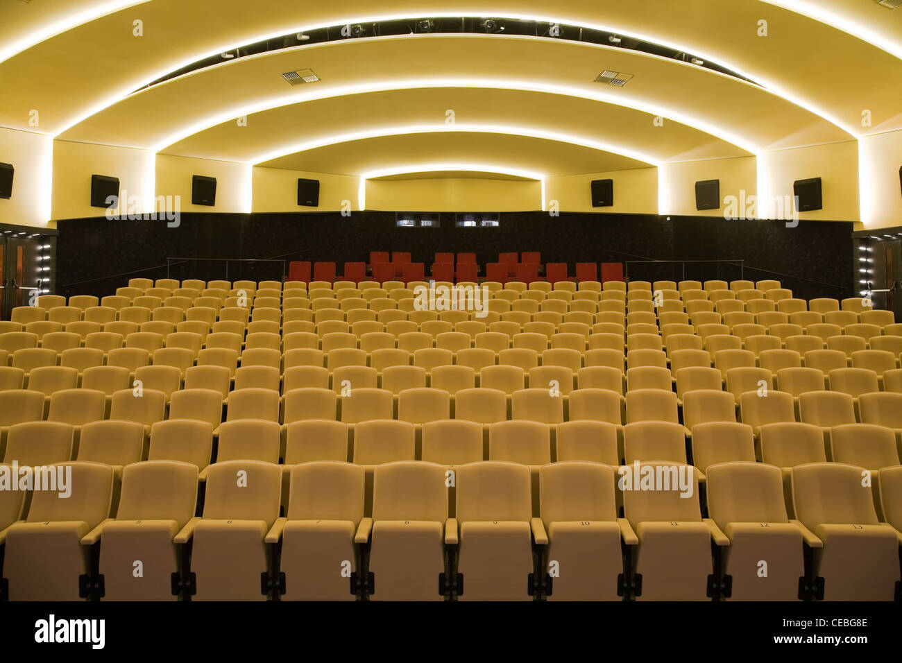 Empty cinema auditorium with line of chairs. Front view Stock Photo - Alamy