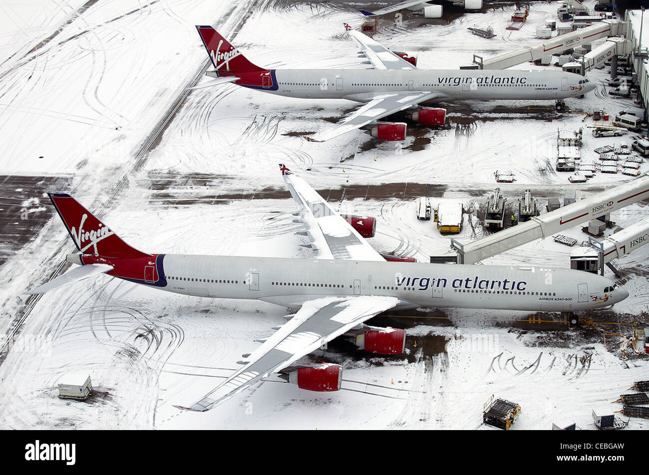 Virgin atlantic aircraft in the snow at heathrow airport london Stock ...