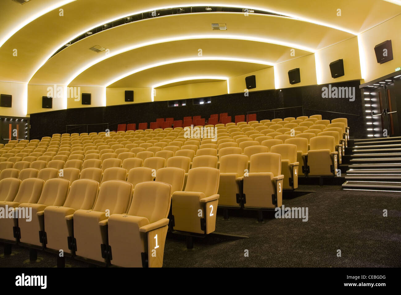 Empty cinema auditorium with line of chairs. Side view Stock Photo - Alamy