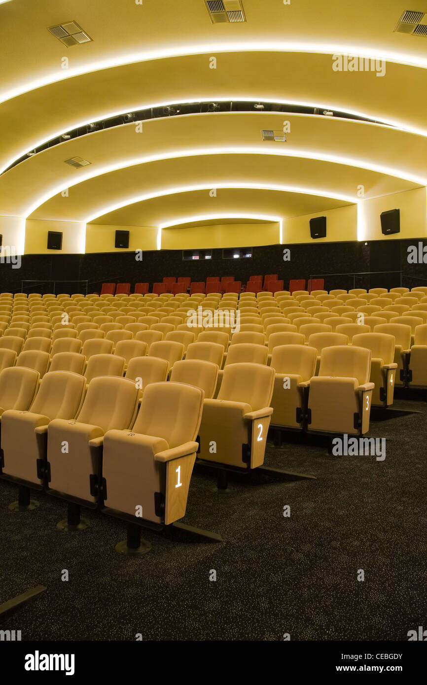Empty cinema auditorium with line of chairs. Side view Stock Photo - Alamy