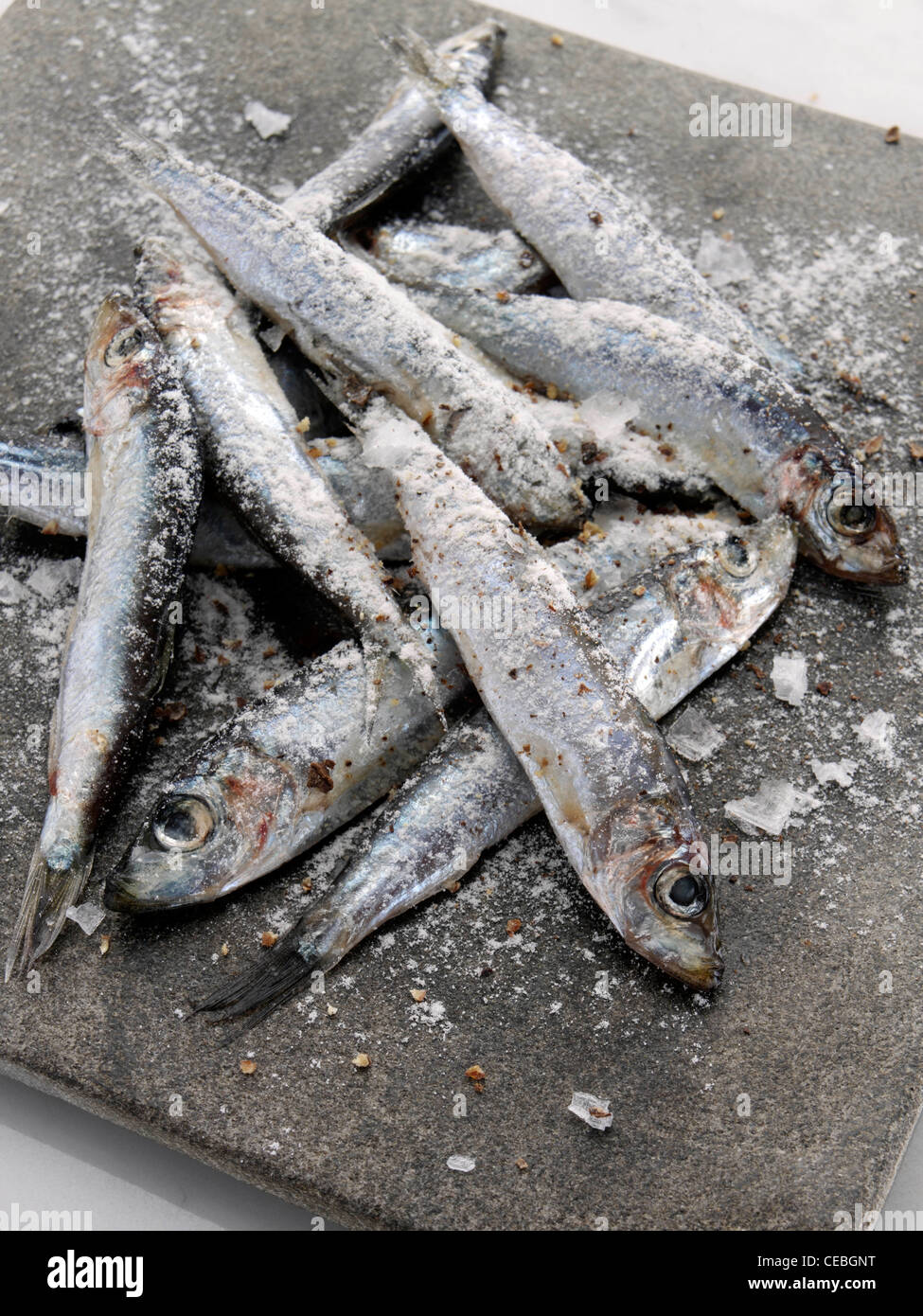A slab of fresh seasoned whitebait Stock Photo - Alamy