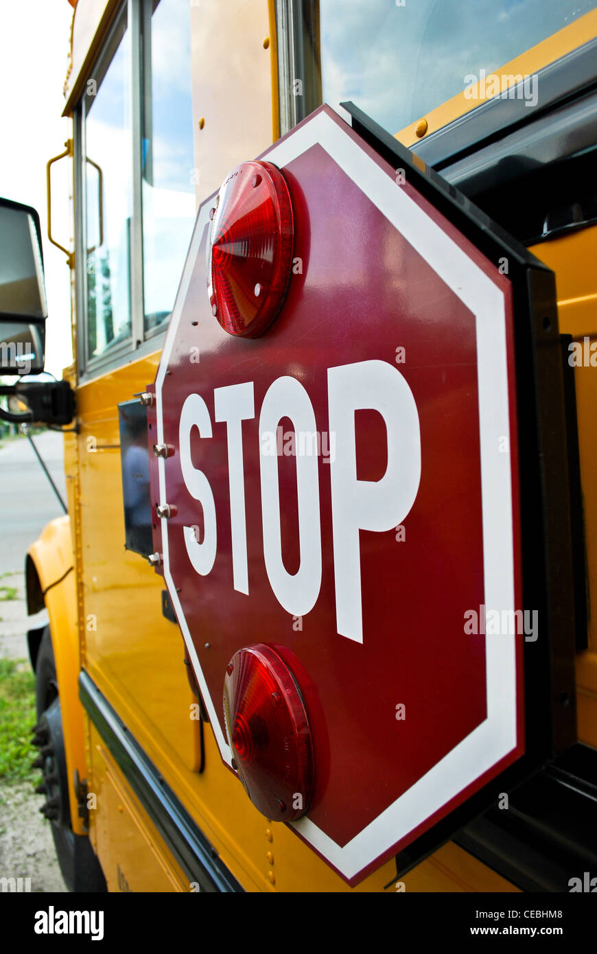 Stop sign on the side of an American bus Stock Photo - Alamy