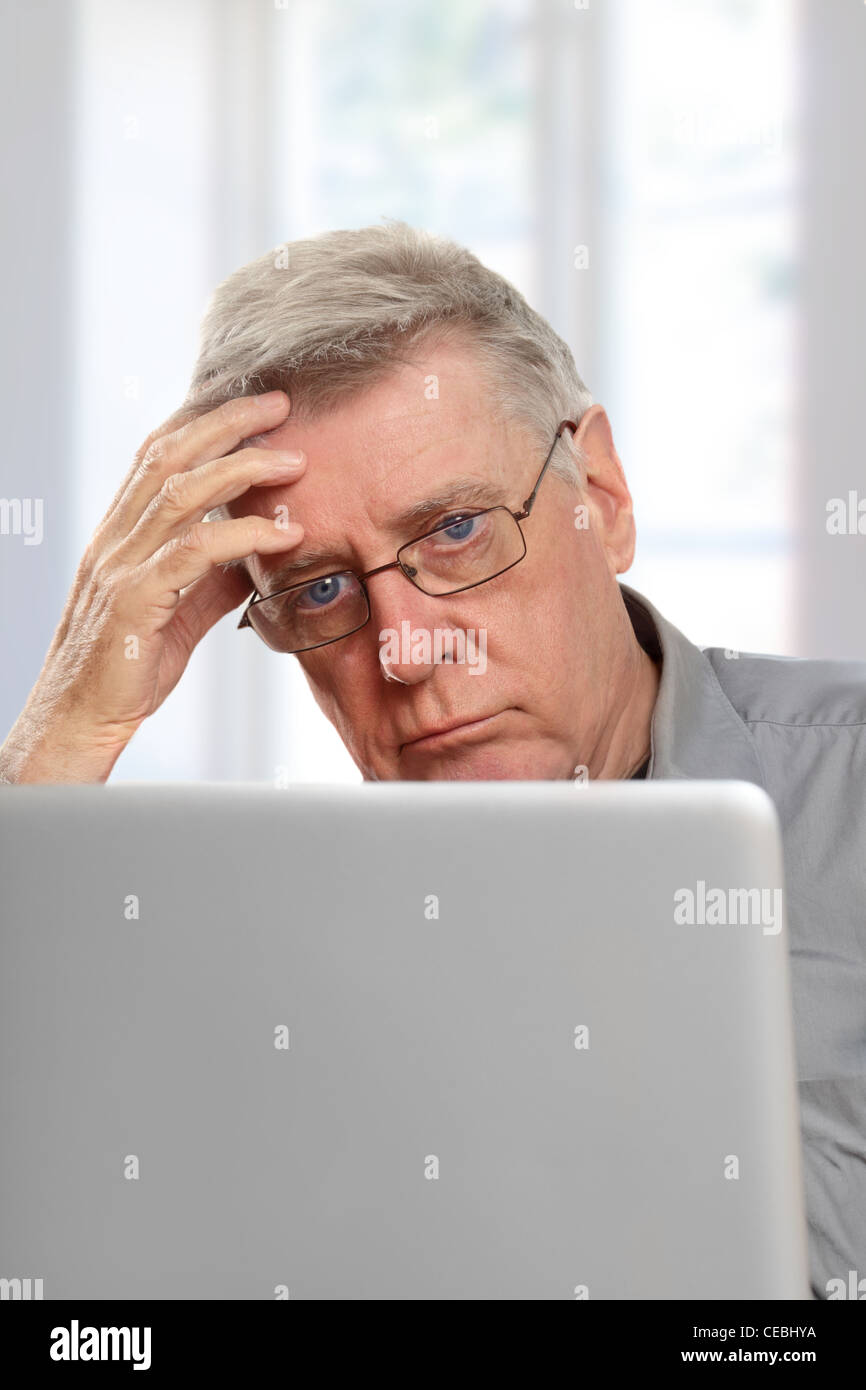 senior using laptop Stock Photo - Alamy
