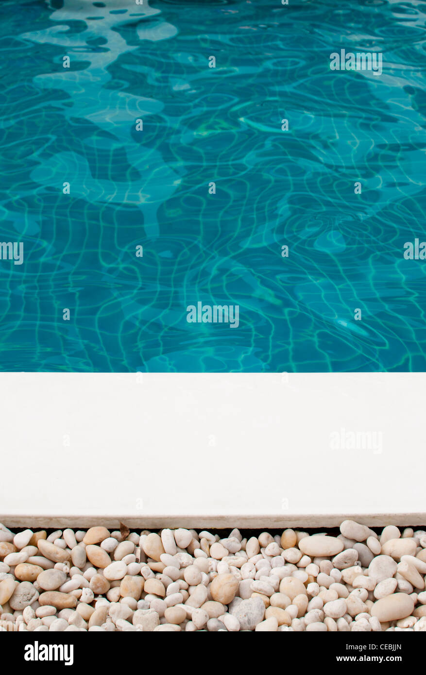 Overspill Swimming Pool Abstract Detail with Blue Water & Pebbles Stock ...