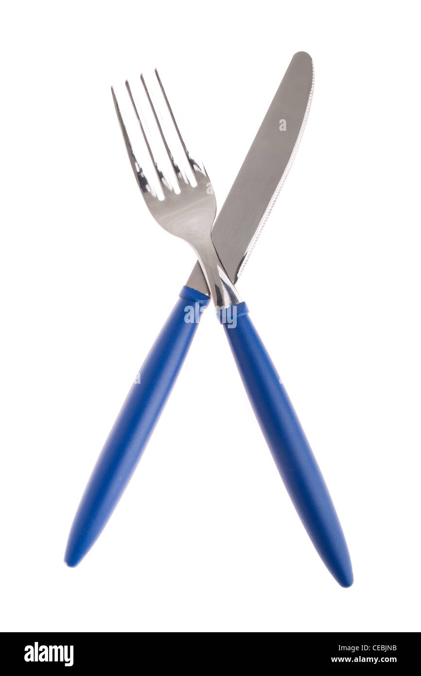 Knife and fork stacked up Stock Photo - Alamy