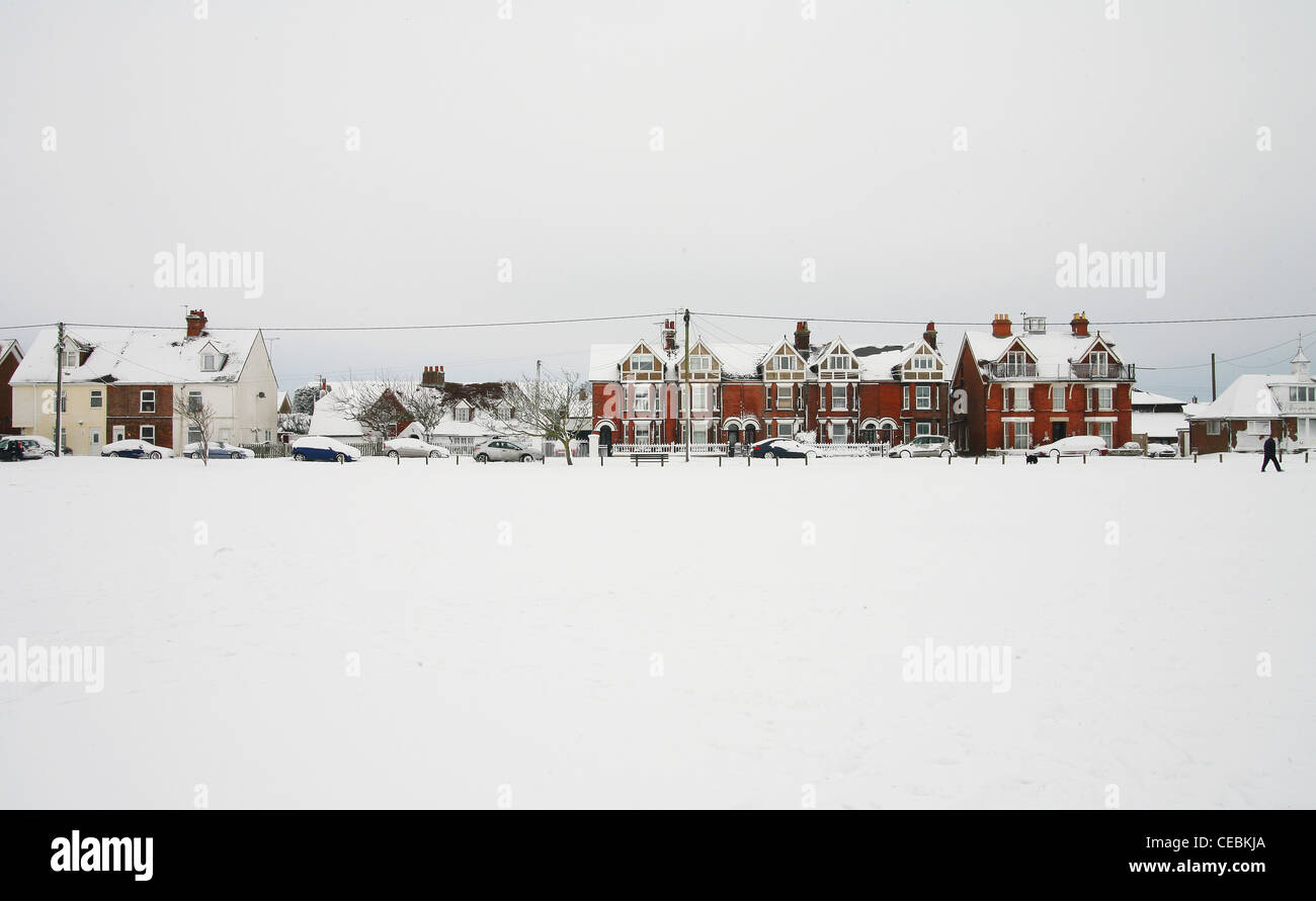 Snowy scenes from Kent, the landscape across an snowy field to a row of ...