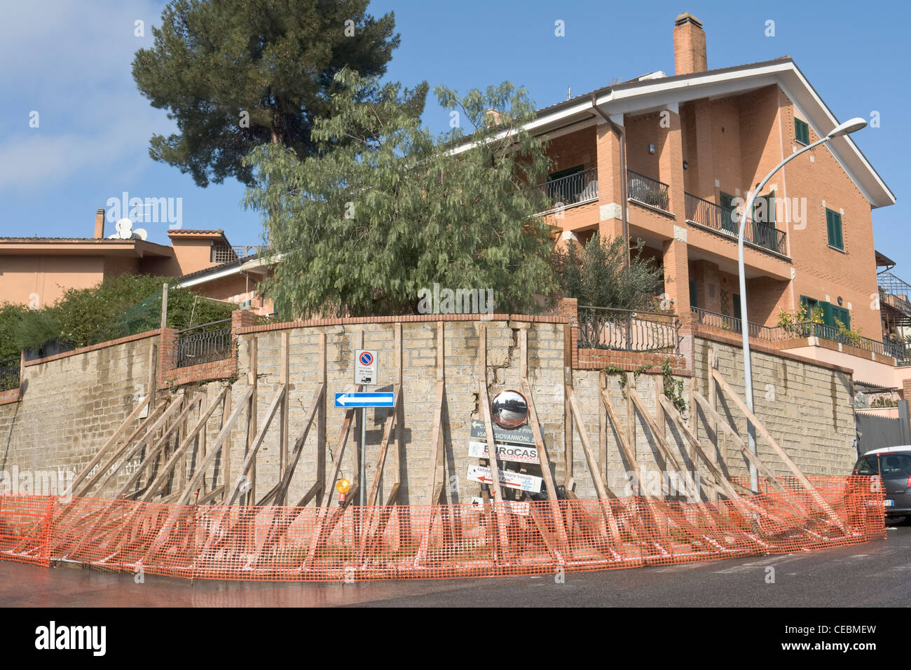 Temporary wooden support for an unsafe wall in Rome, Italy Stock Photo ...