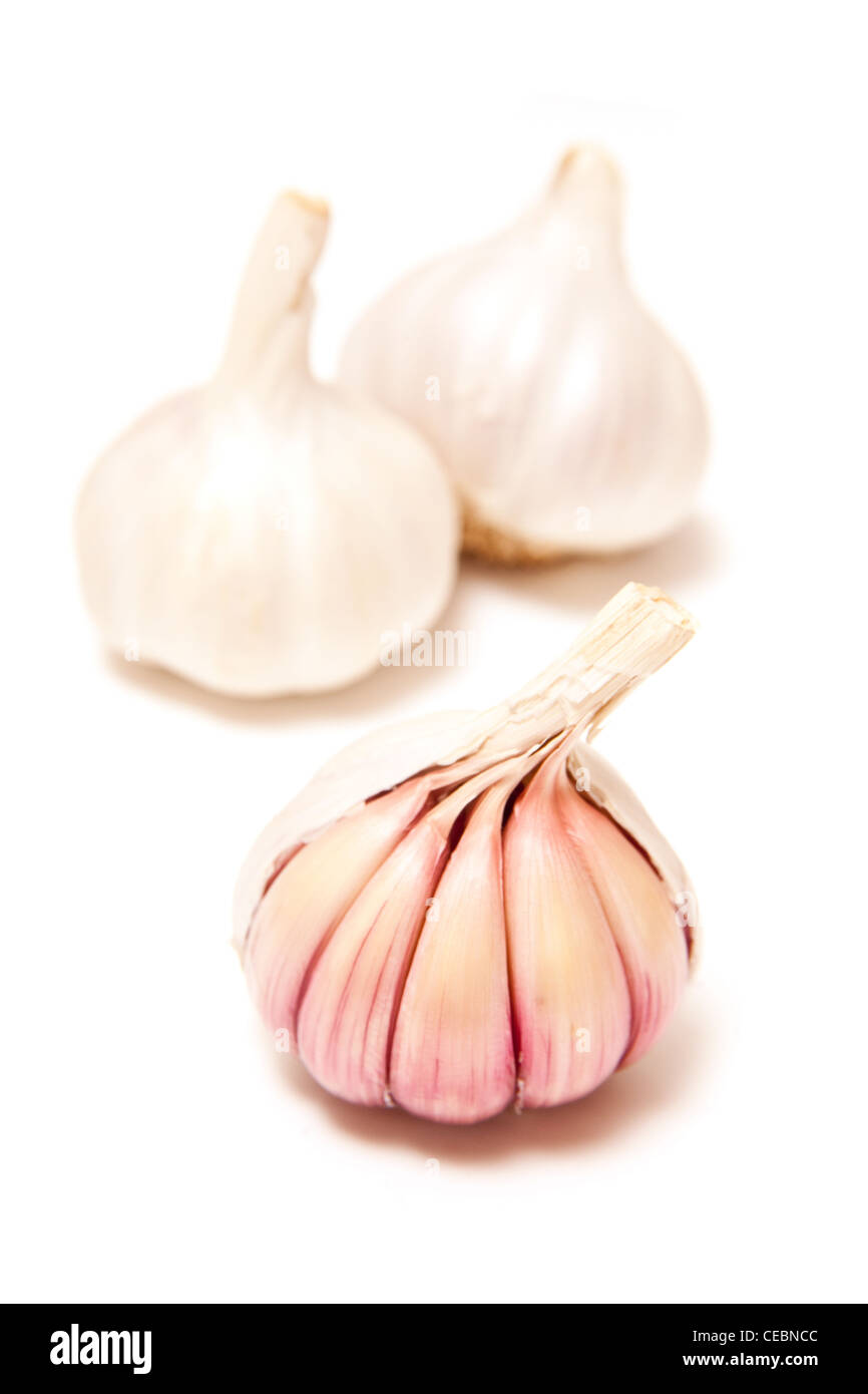Rose or pink garlic bulbs isolated on a white studio background Stock ...