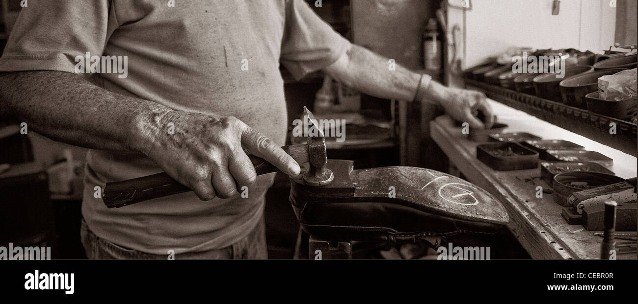 A shoemaker at work Stock Photo - Alamy
