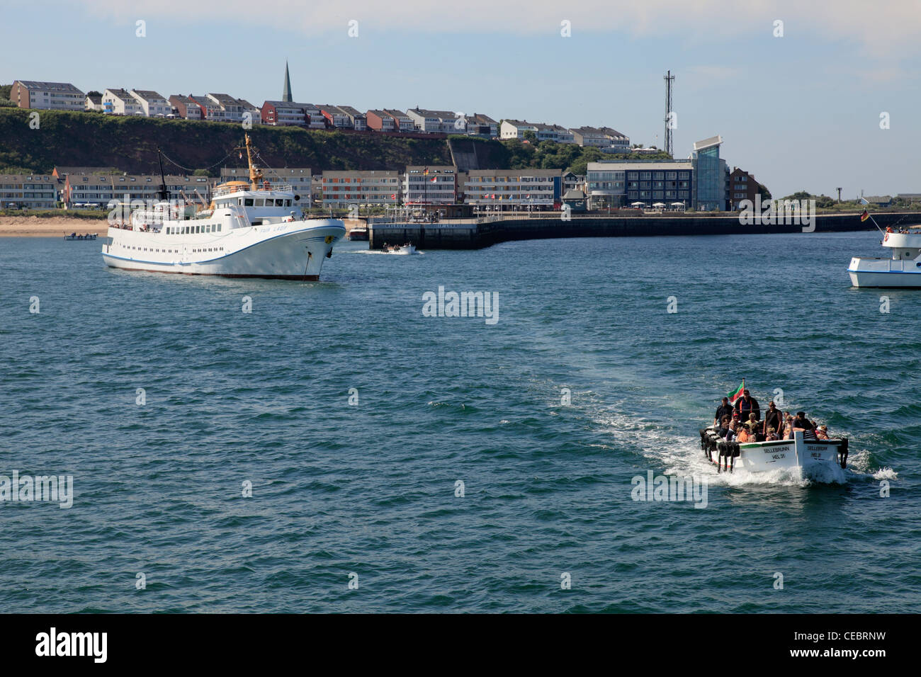 people embarking ferries on Helgoland - the ferry MS Fair Lady in front ...