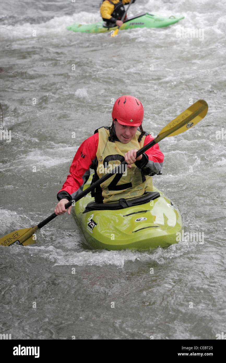 male man canoeist taking part in inter university competition on River ...
