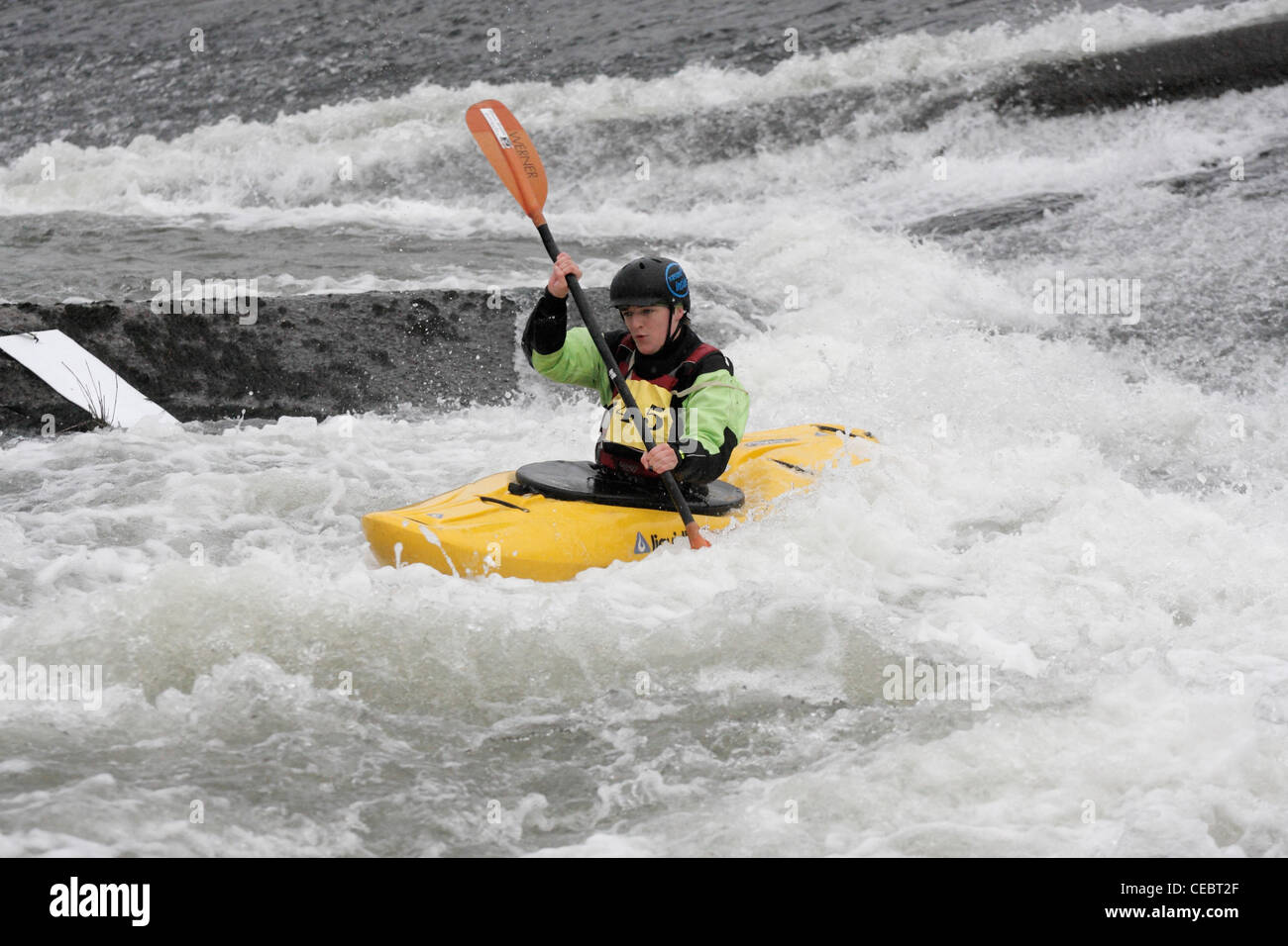 male man canoeist taking part in inter university competition on River ...