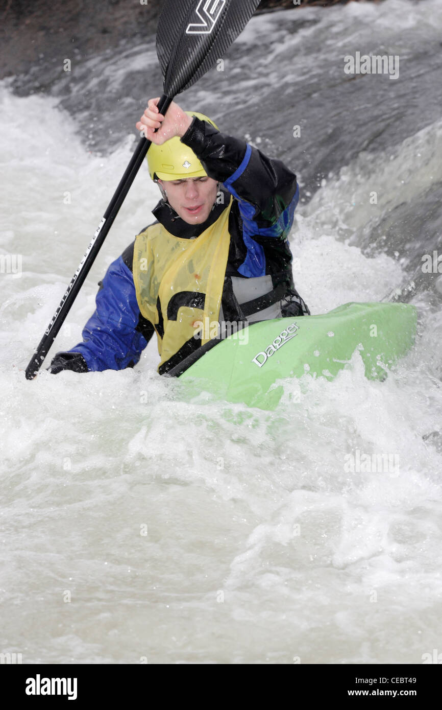 male man canoeist taking part in inter university competition on River ...