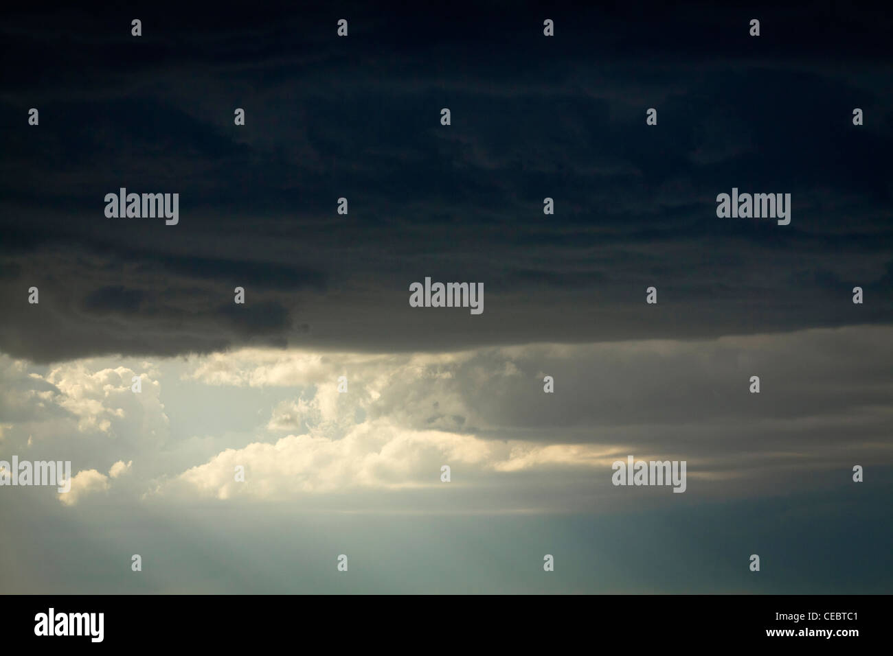 Closeup of dramatic sky from below low angle looming storm nobody ...