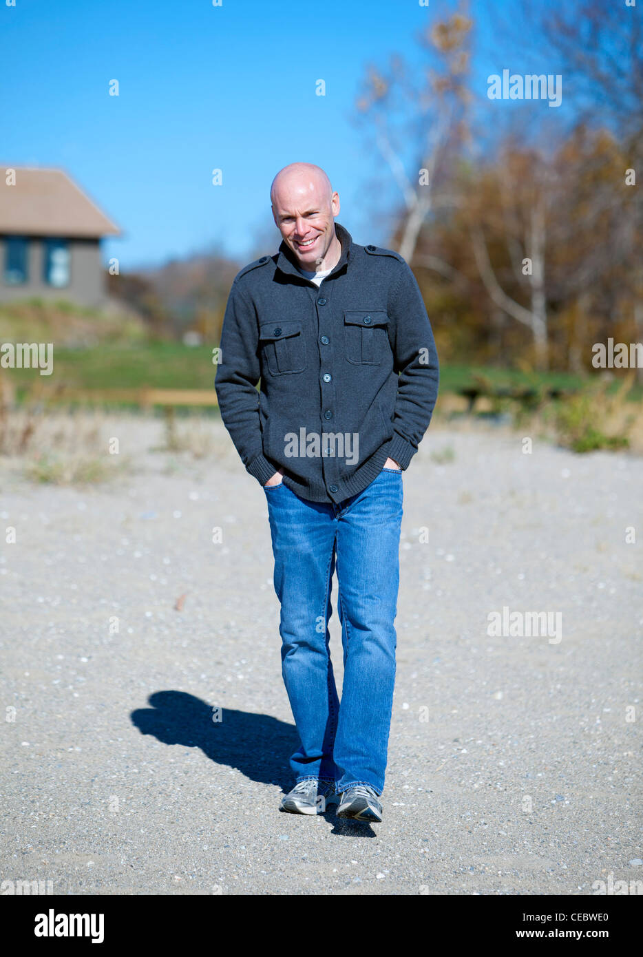 Handsome man in sweater going for a walk Stock Photo - Alamy