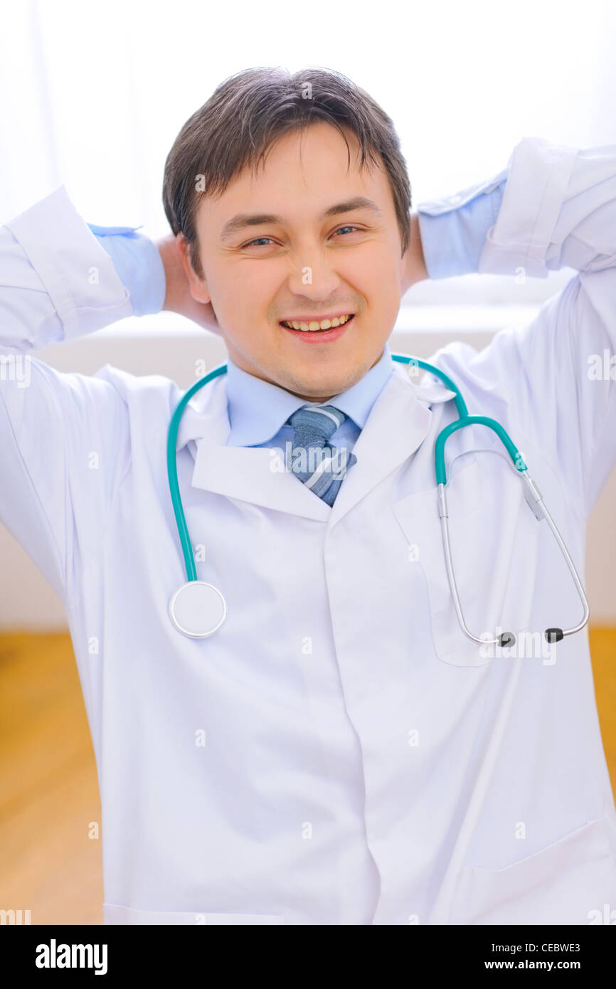 Happy male physician relaxing hi-res stock photography and images - Alamy