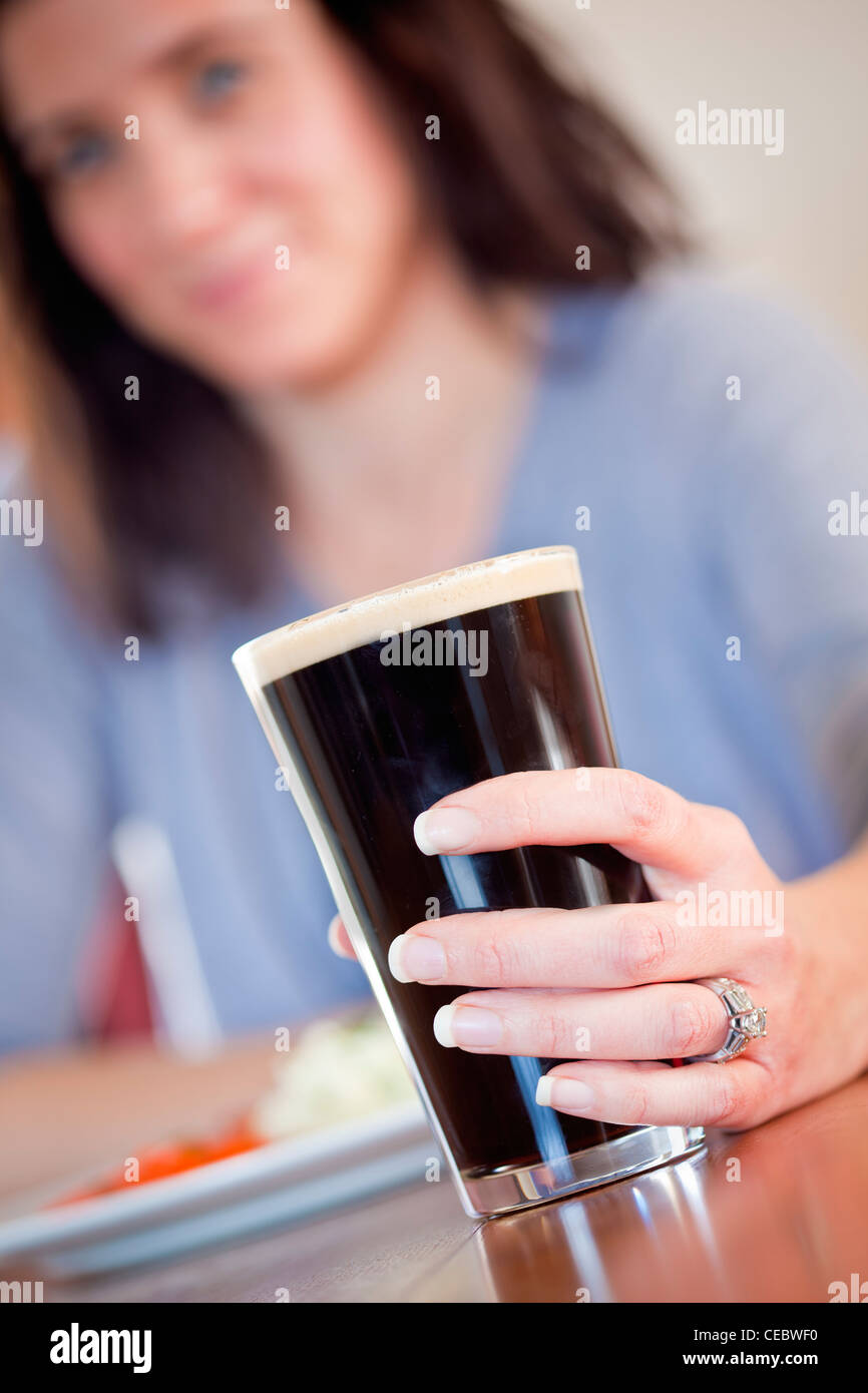 Holding a pint of guinness hi-res stock photography and images - Alamy
