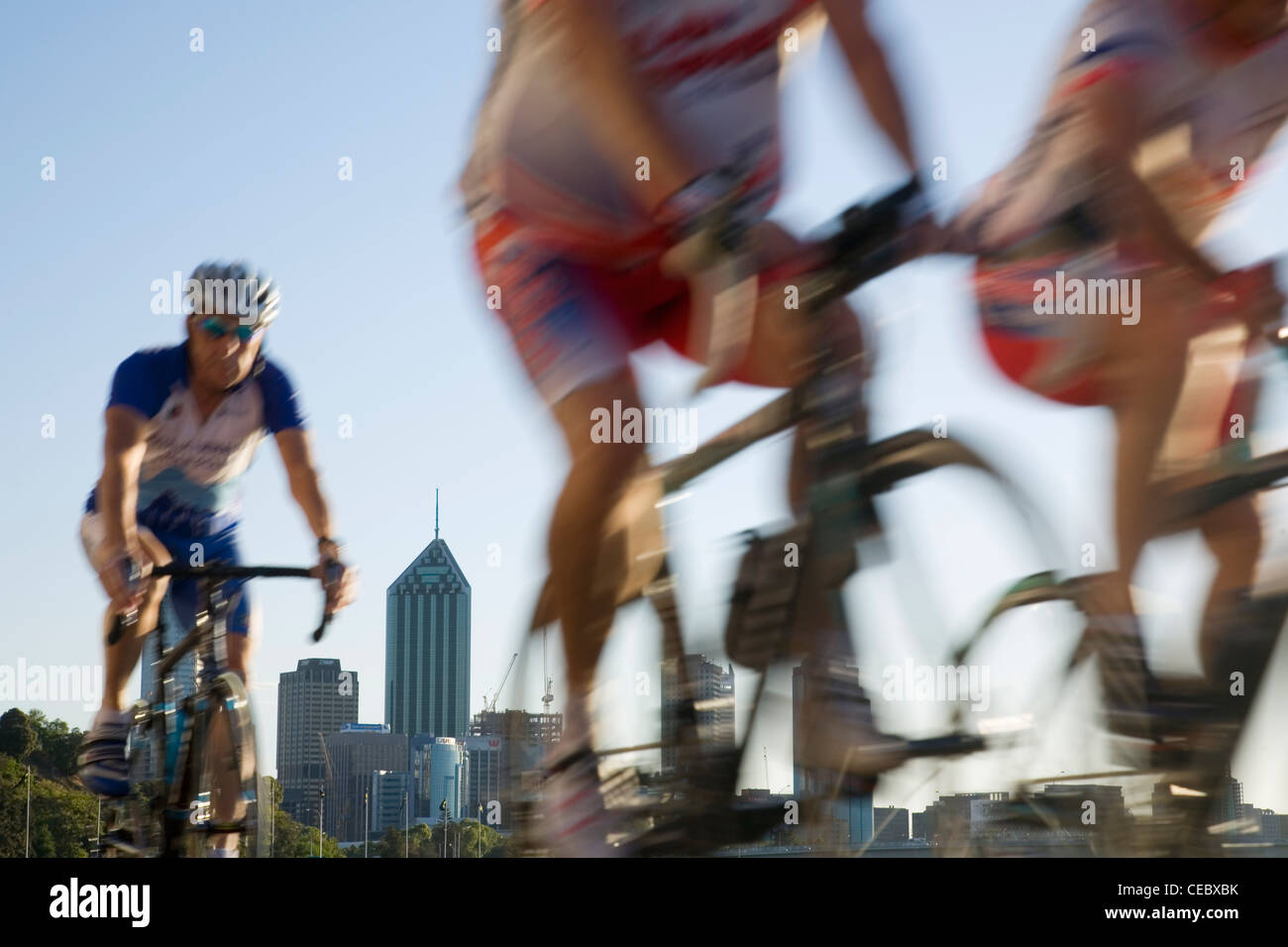 Early morning cyclists on the Perth riverside. Perth, Western Australia ...