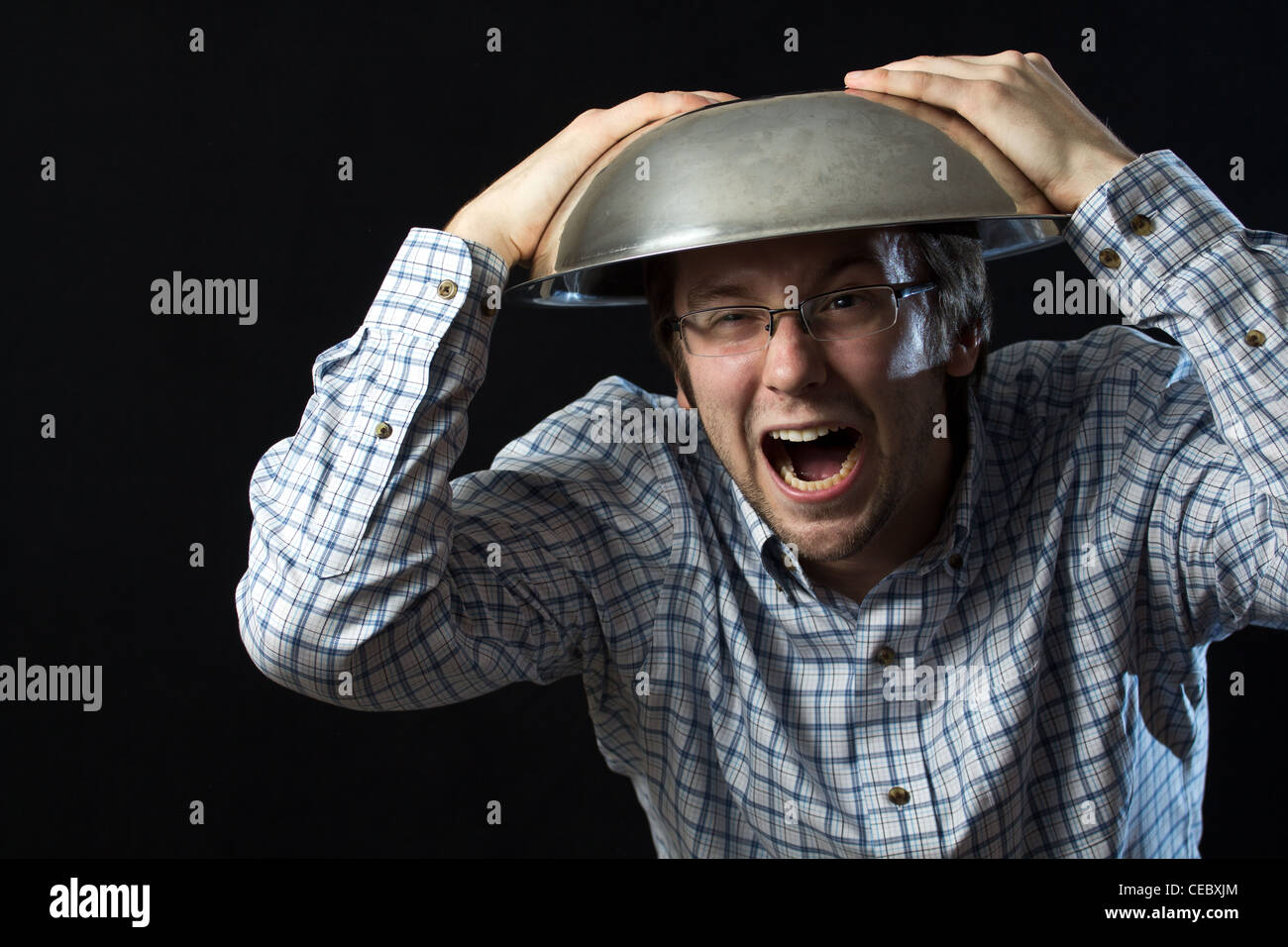 Shouting Man With Bowl On Head Stock Photo - Alamy
