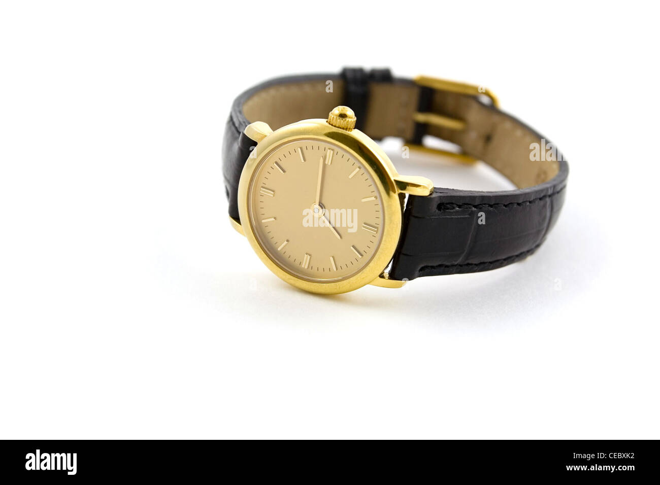 A female golden wrist watch with leather wristlet Stock Photo - Alamy