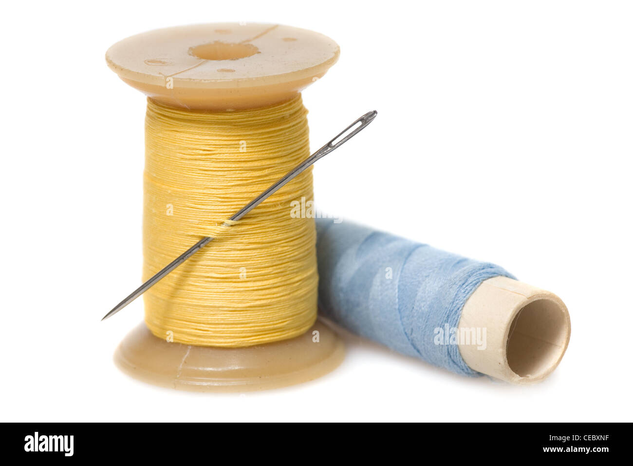 Sewing tools - needle and strings. Isolated on white background Stock ...