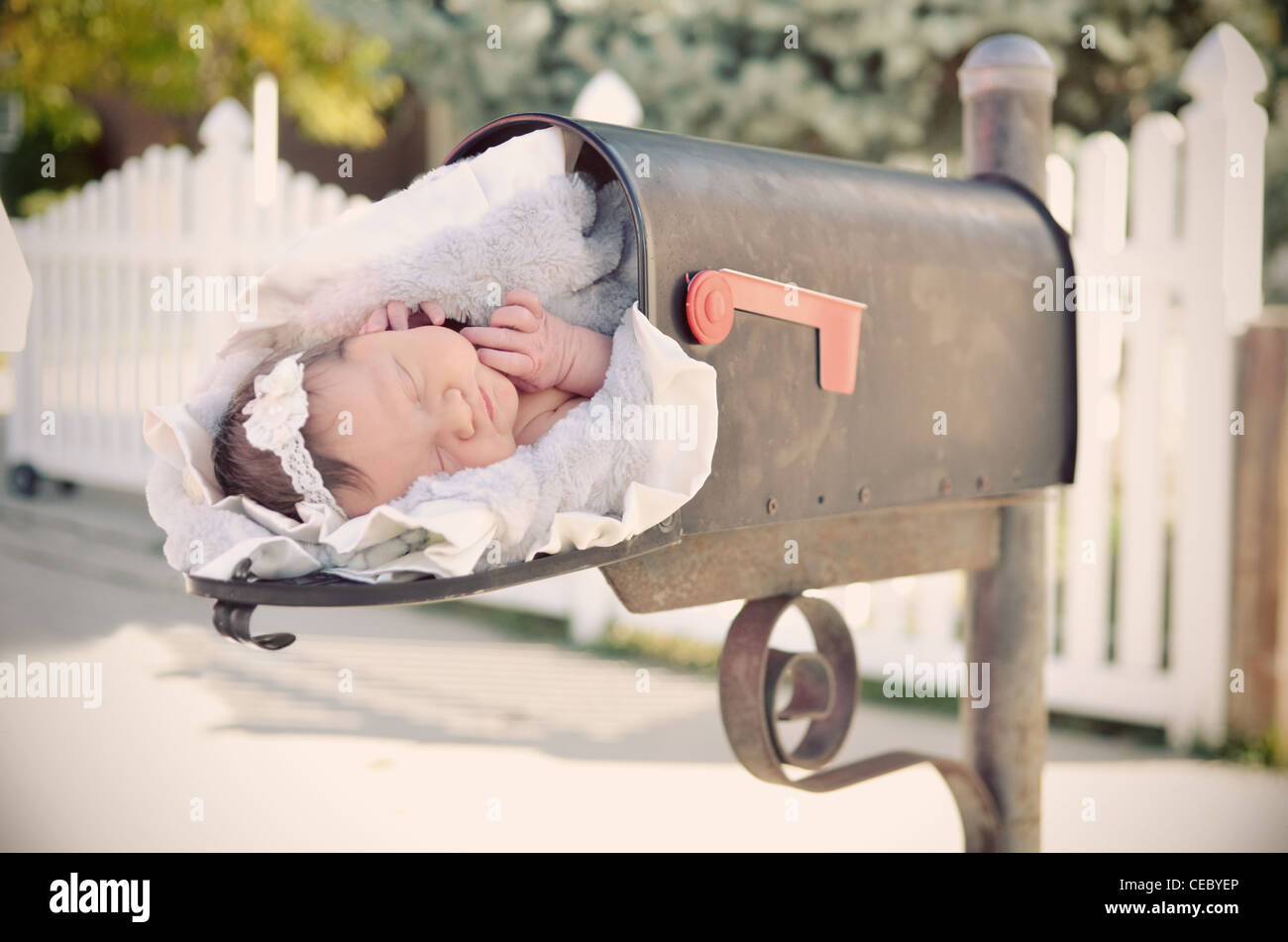 Newborn baby inside mailbox Stock Photo - Alamy