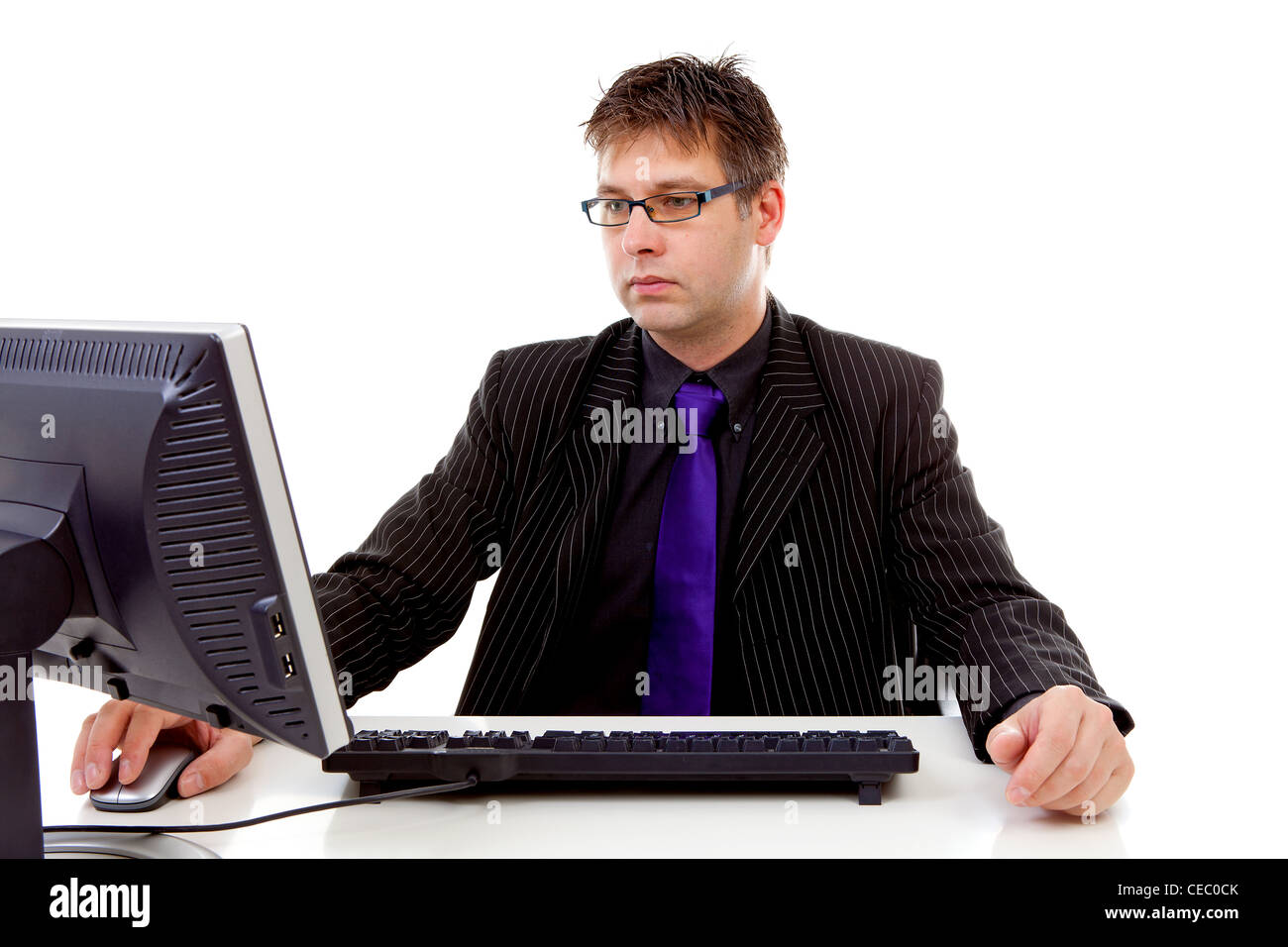 Businessman sitting behind desk at work over white background Stock ...