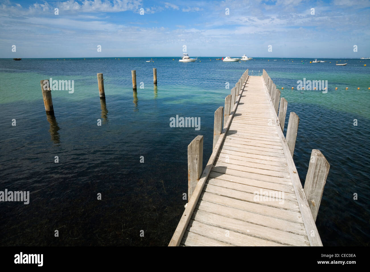 View along wooden jetty into the sea. Thomson Bay, Rottnest Island ...