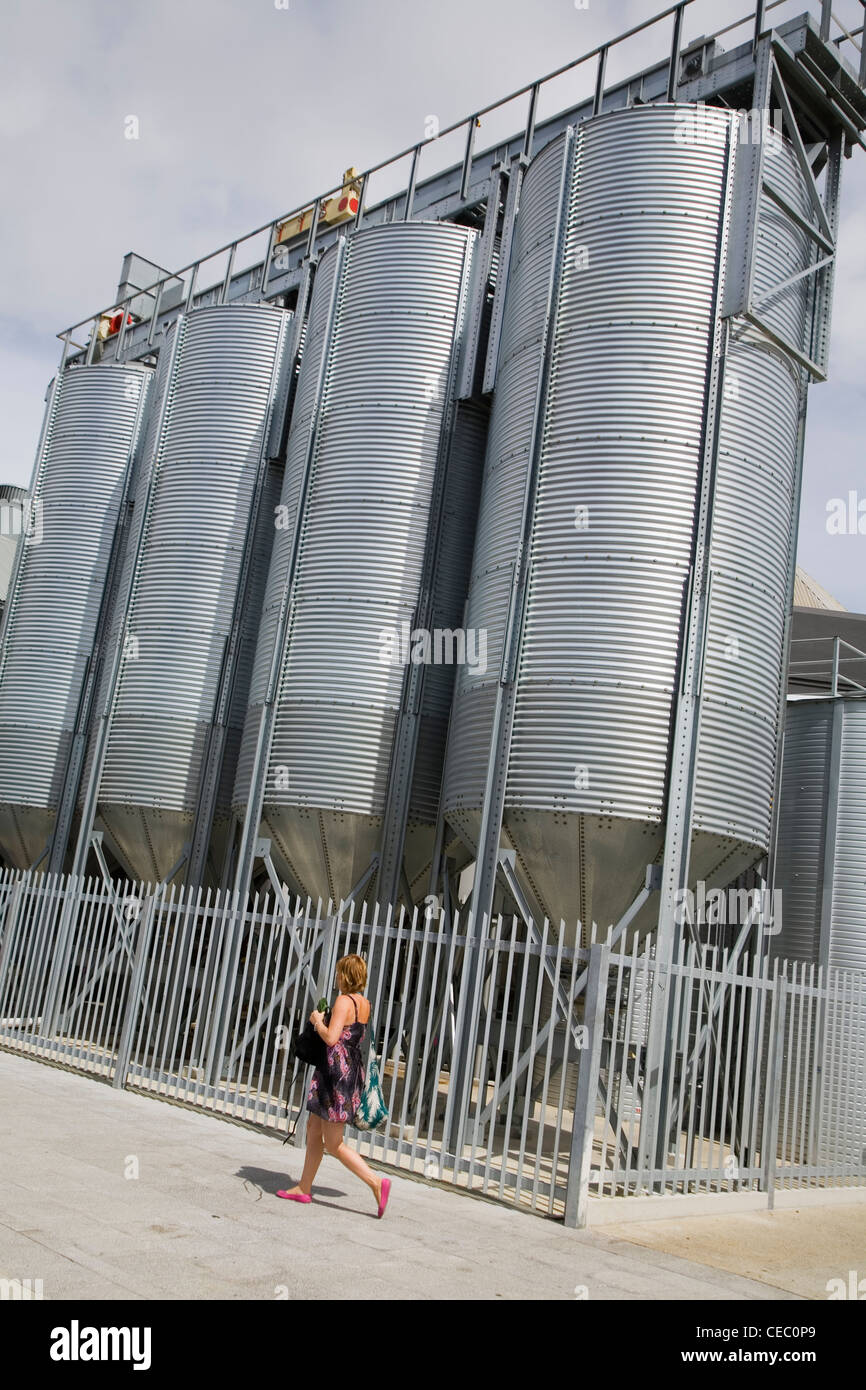 A woman walks past the beer brewing vats at the Little Creatures ...