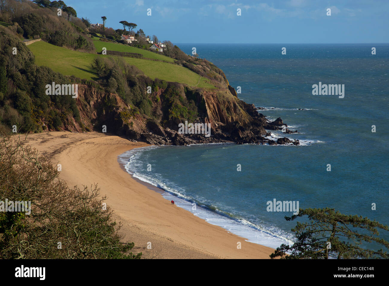 couple walking along Blackpool Sands beach, South Hams, South Devon ...